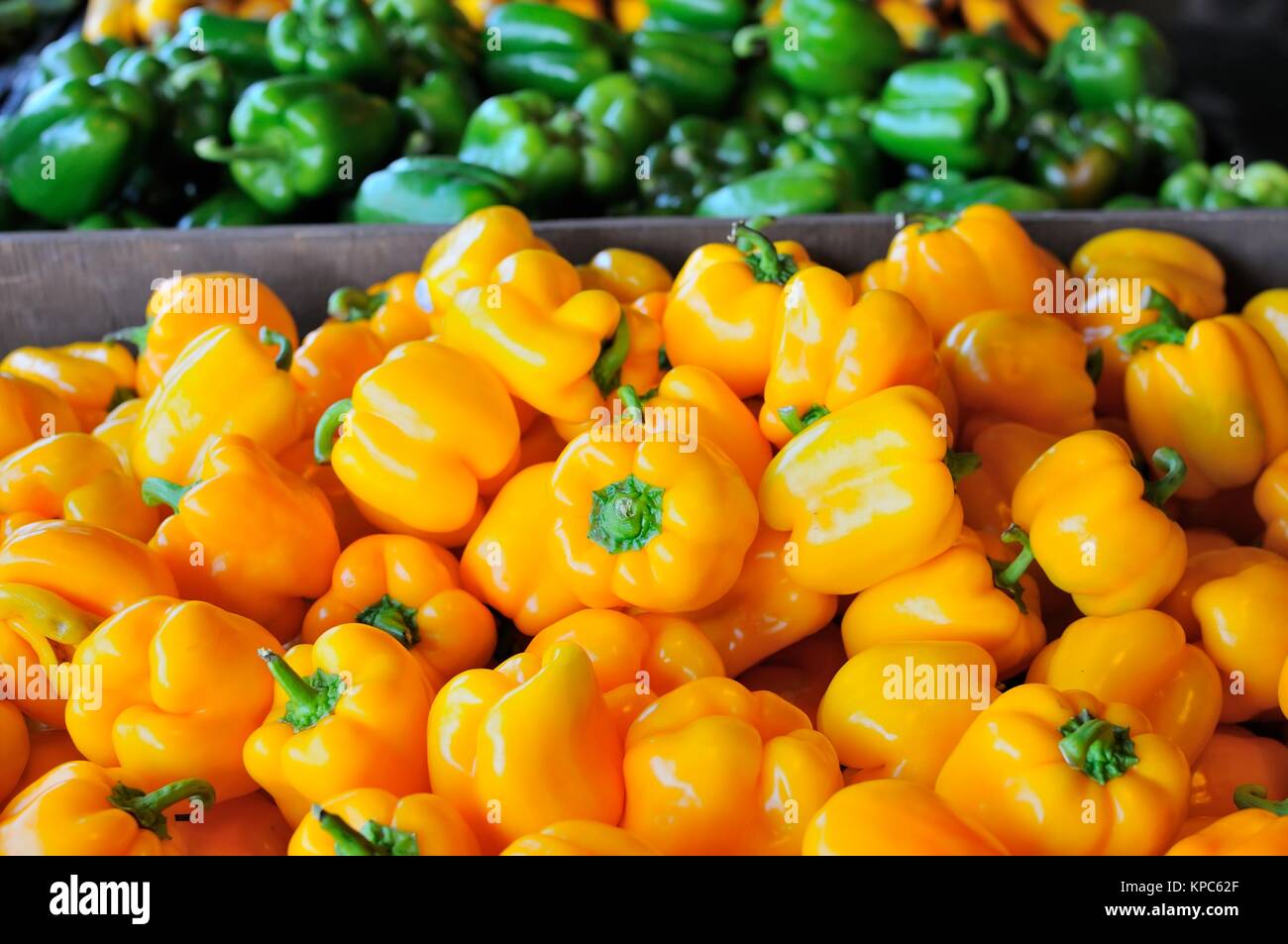 Colorful yellow peppers at a grocery store Stock Photo - Alamy