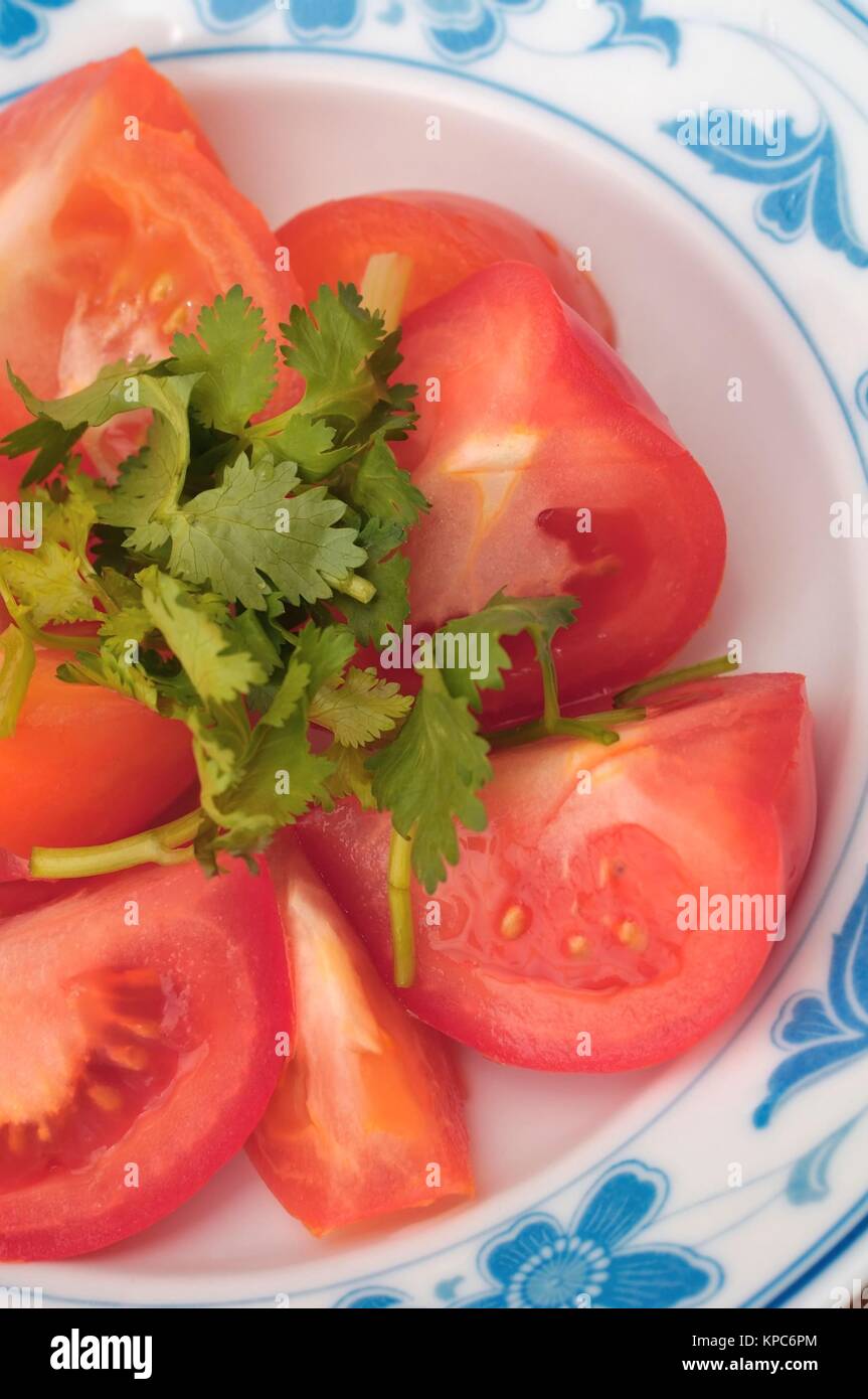 Fresh, healthy red tomatos with parsley topping Stock Photo - Alamy