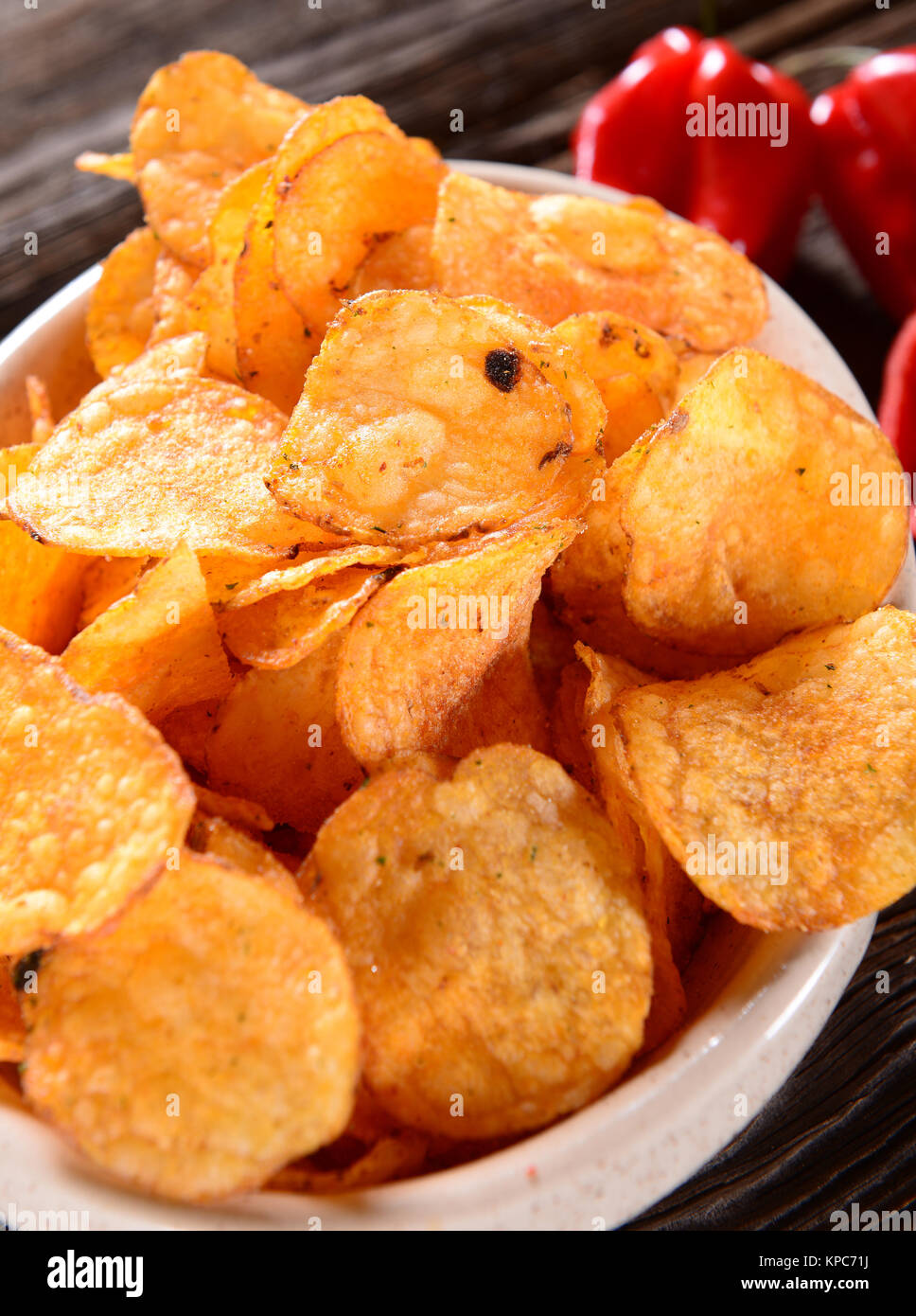 Paprika Potato Chips on rustic background Stock Photo - Alamy