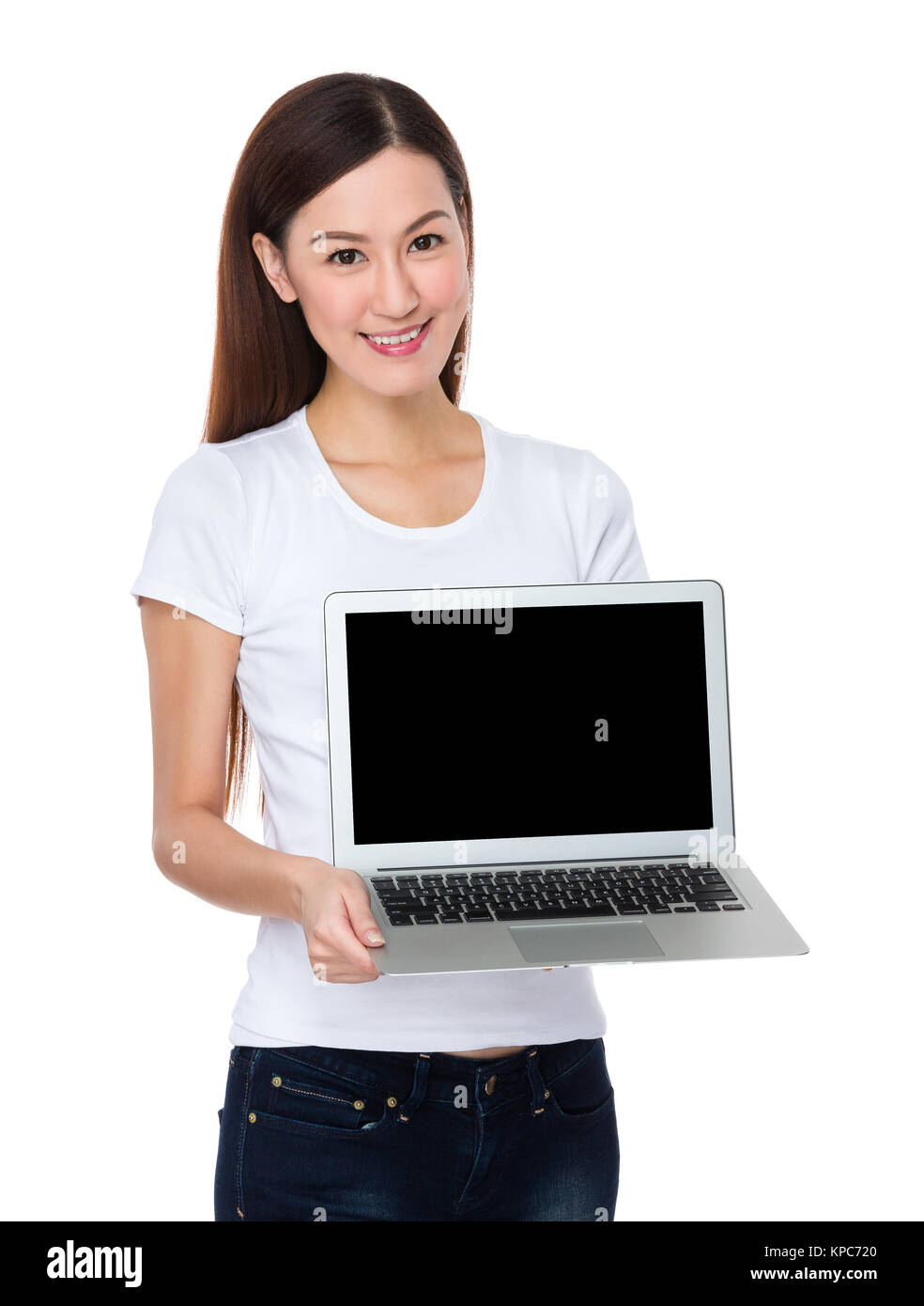 Young woman show with the blank screen of laptop computer Stock Photo ...