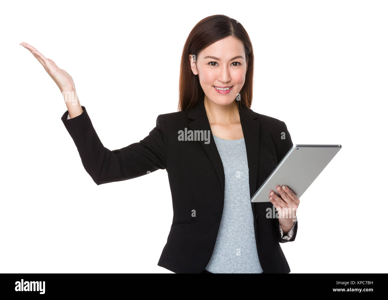 Young businesswoman use of tablet pc and open hand palm for promoting ...