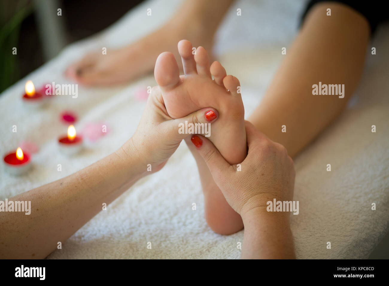 relaxing foot massage Stock Photo - Alamy