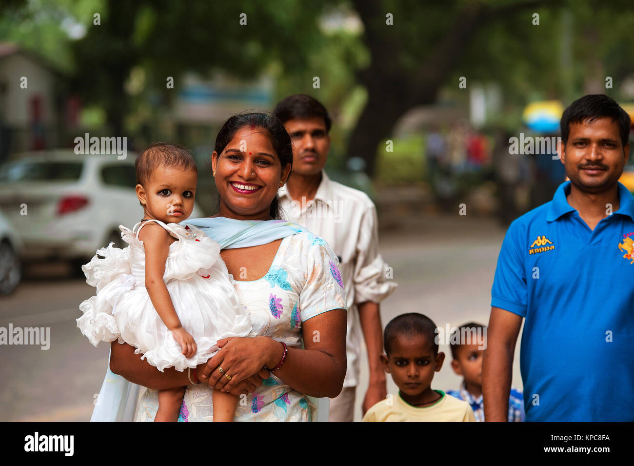 Indian family walking on the street - New Delhi street photography ...