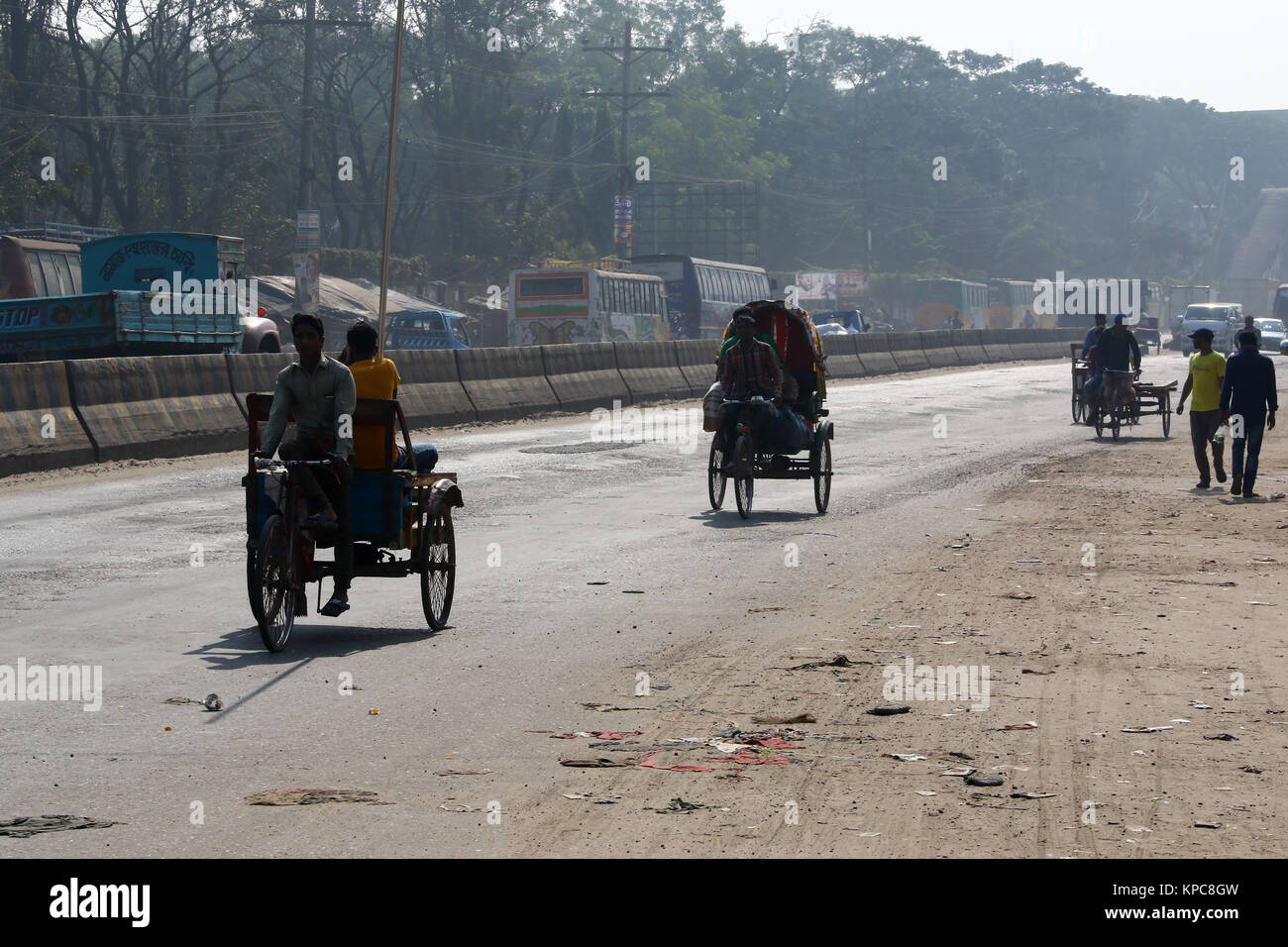 A battery-run rickshaw plying the Dhaka-Aricha highway near Amin Bazar ...