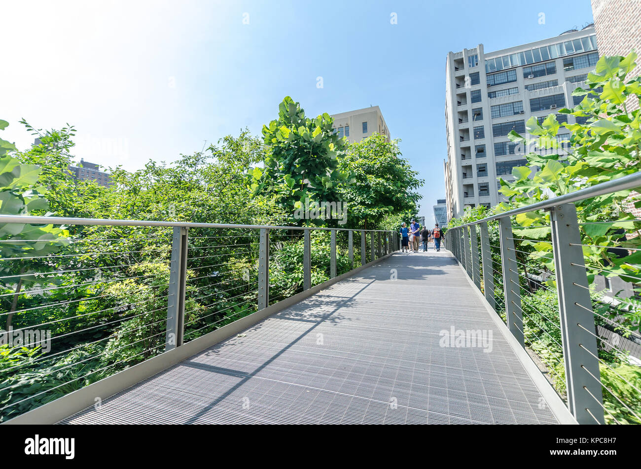 NEW YORK CITY - JULY 22: People walk along the High Line Park on July ...