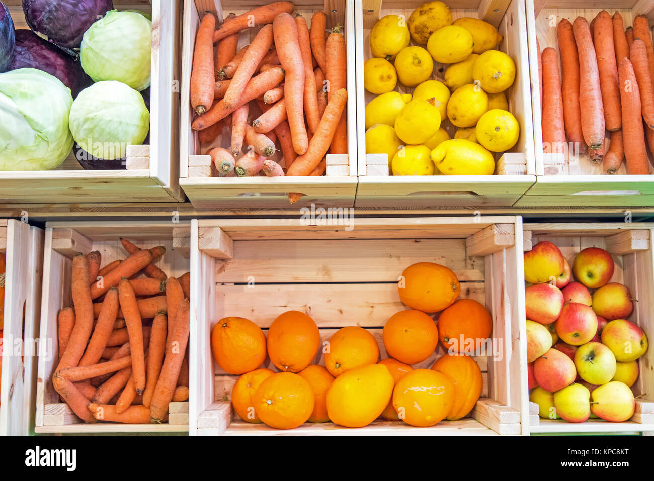 Fruit and vegetables in wooden boxes at a market Stock Photo - Alamy
