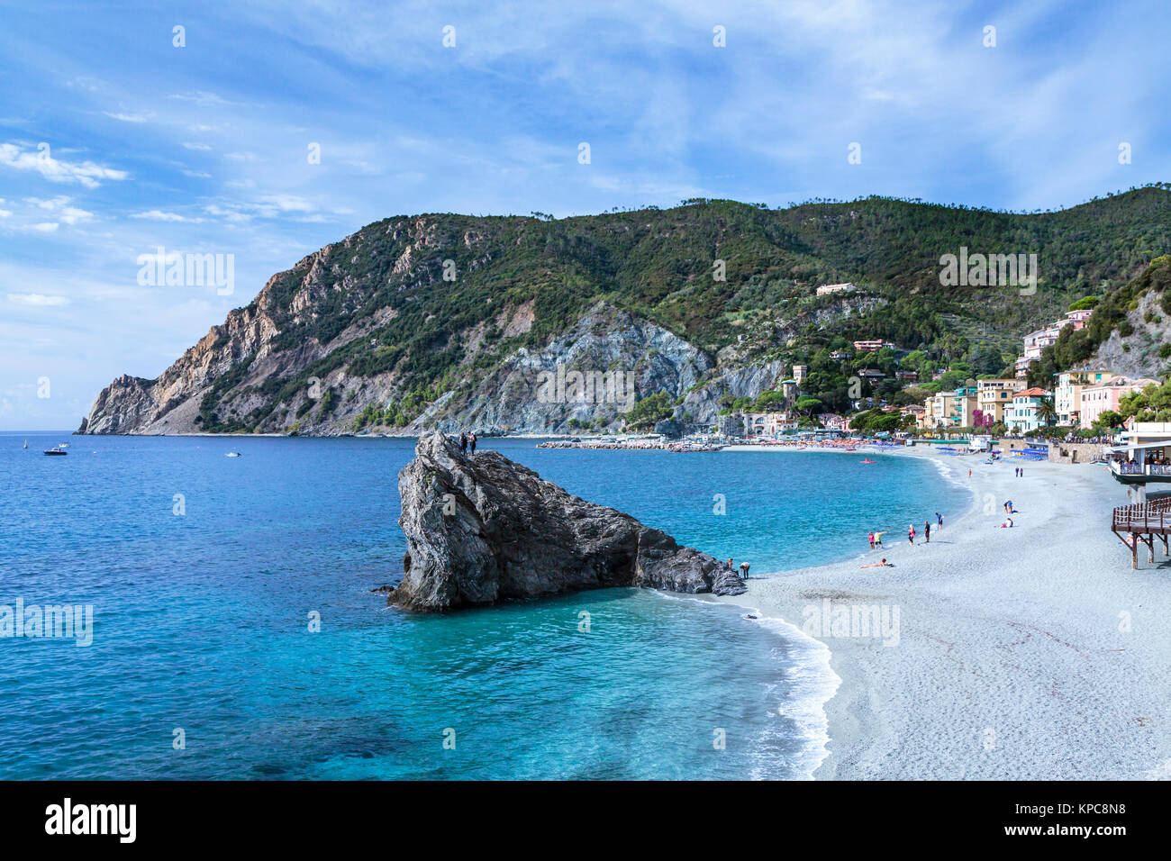 The large rock and sandy beach in Monterosso al Mare, Liguria, Italy ...