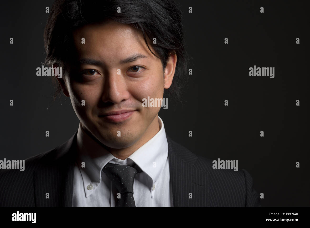 Dark and Smiling Asian Male Portrait Stock Photo - Alamy