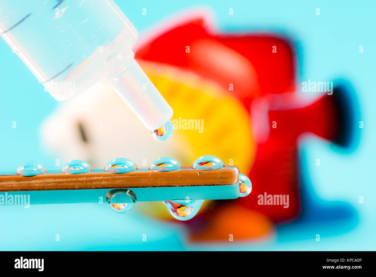 Fish reflections in a drops from a syringe Stock Photo - Alamy