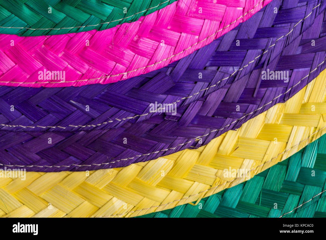 Colorful background of woven straw Stock Photo - Alamy