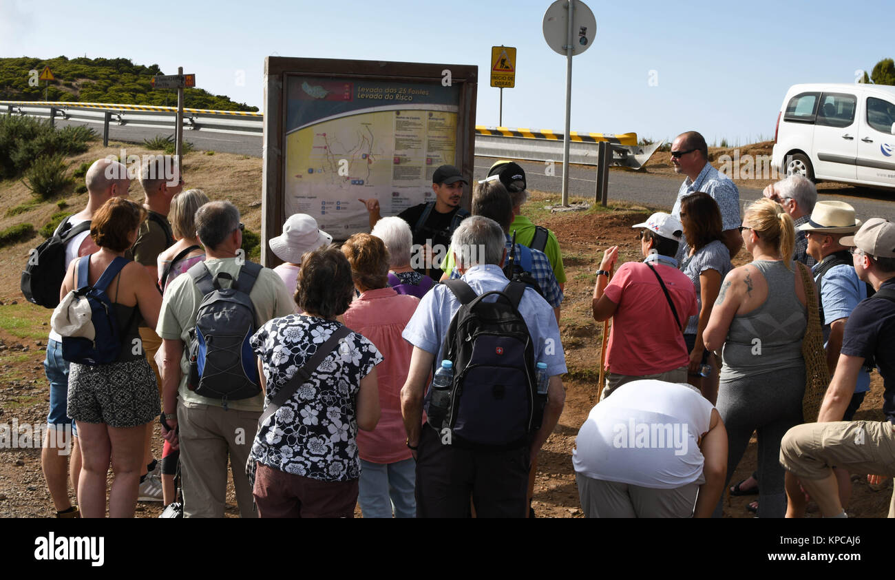 Madeira, Portugal - September 2017: A guide explains the walking route ...