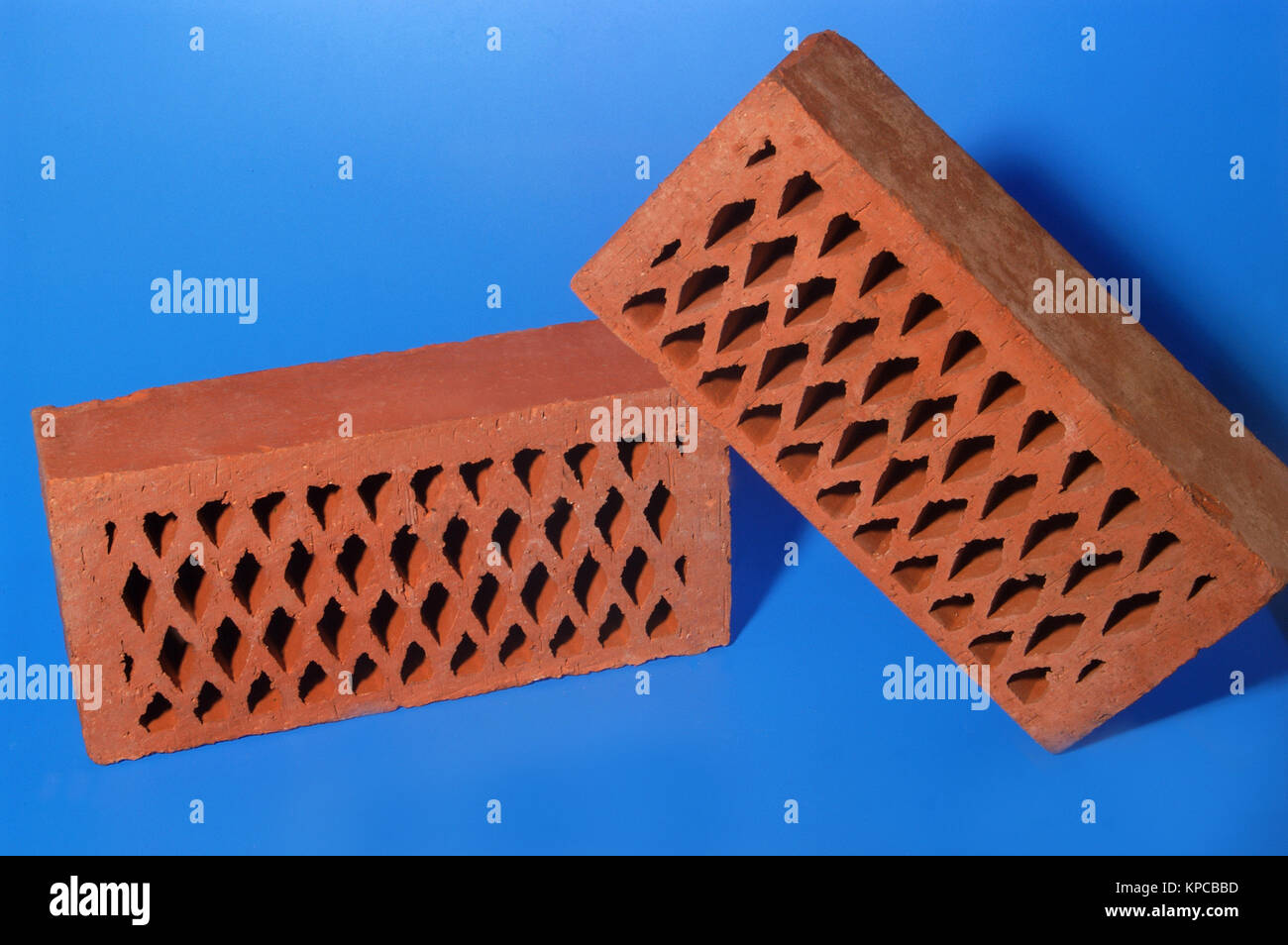 Brick on blue background Stock Photo - Alamy
