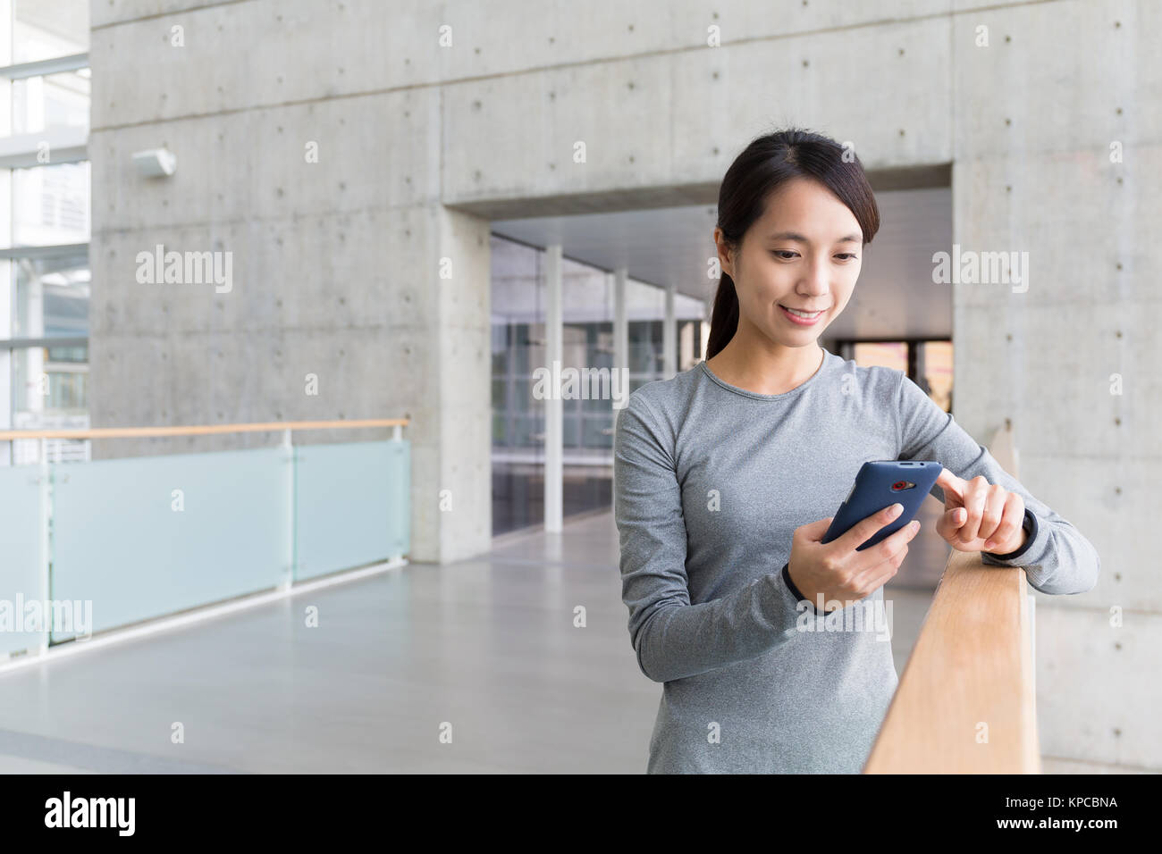 Asian woman use of the mobile phone Stock Photo - Alamy
