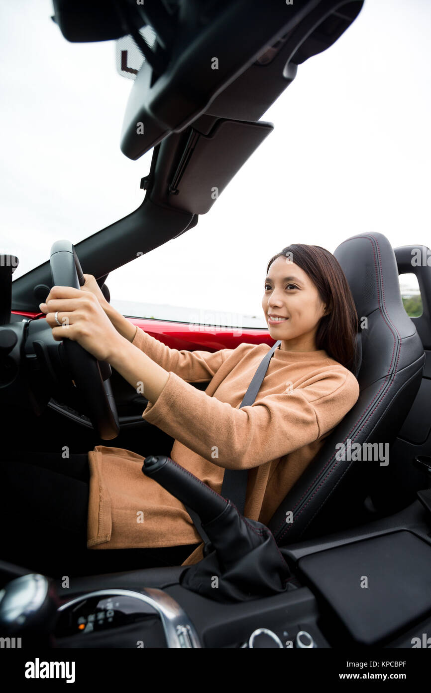 Young Woman driving convertible Stock Photo - Alamy