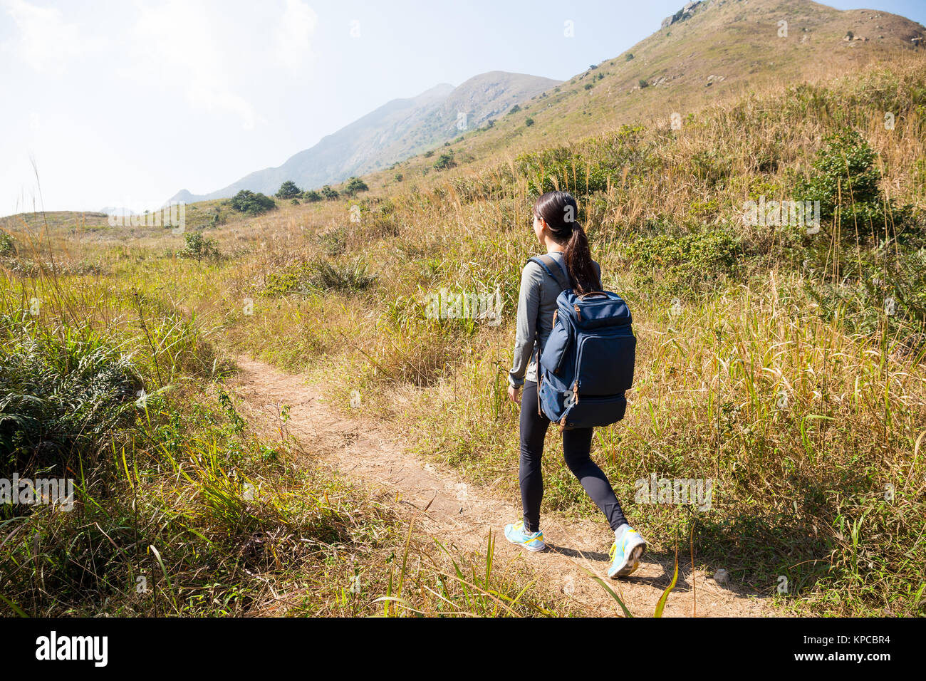 Woman go hiking Stock Photo - Alamy
