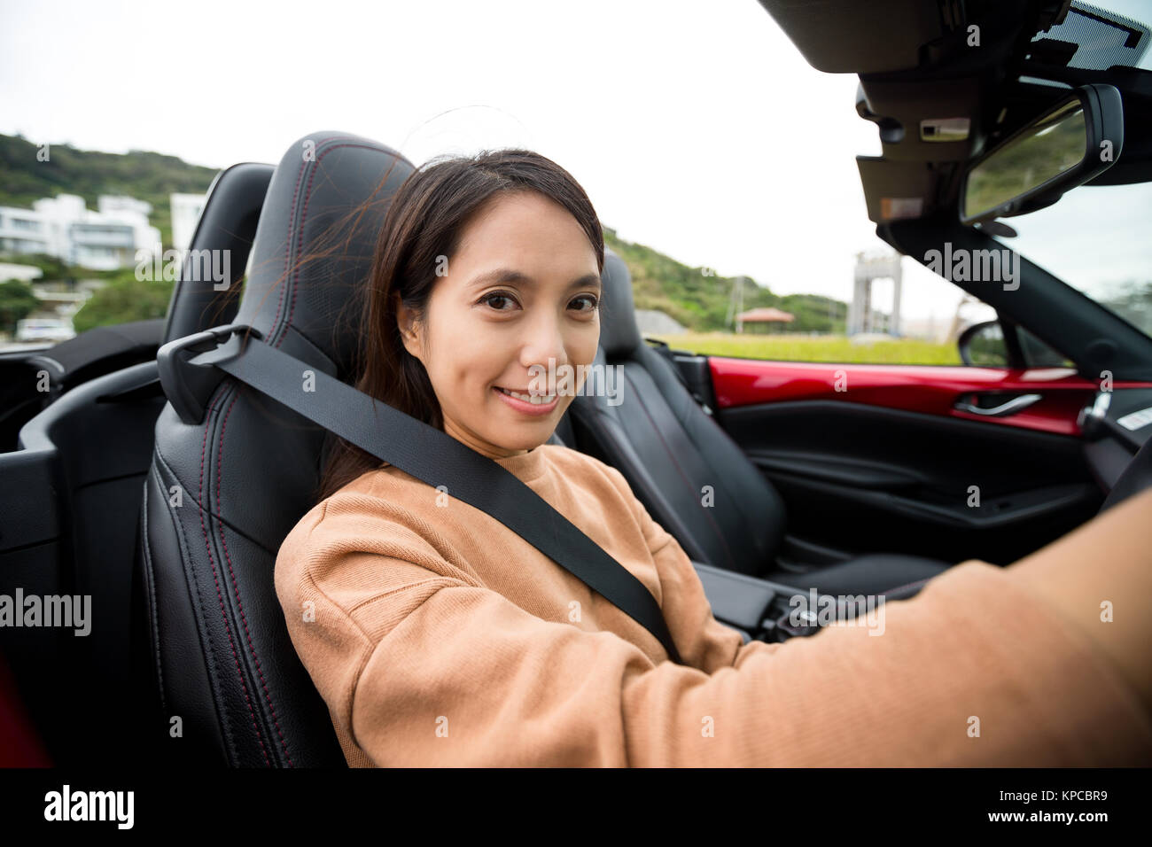 Woman driving convertible Stock Photo - Alamy