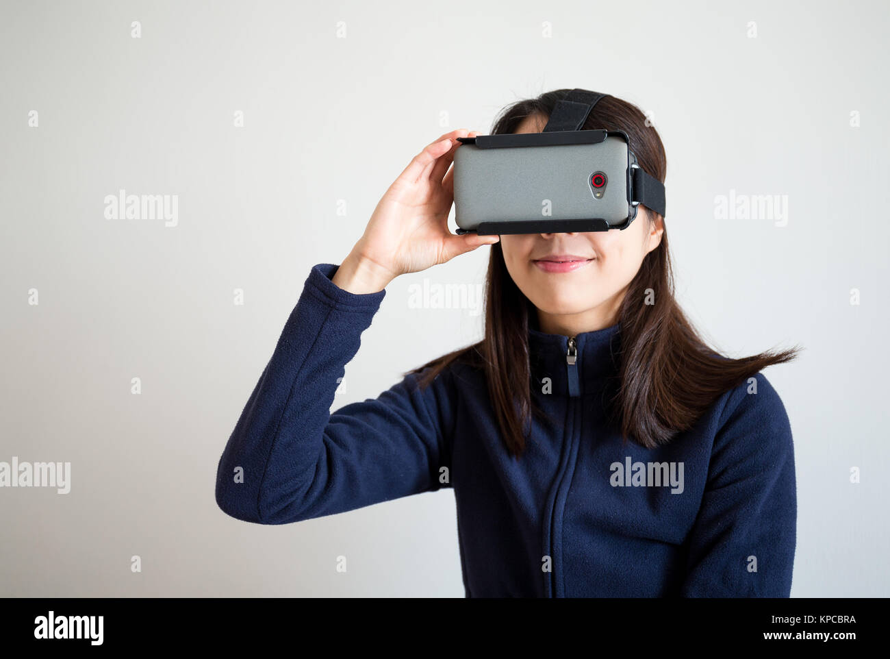 Woman use of the vr device Stock Photo - Alamy