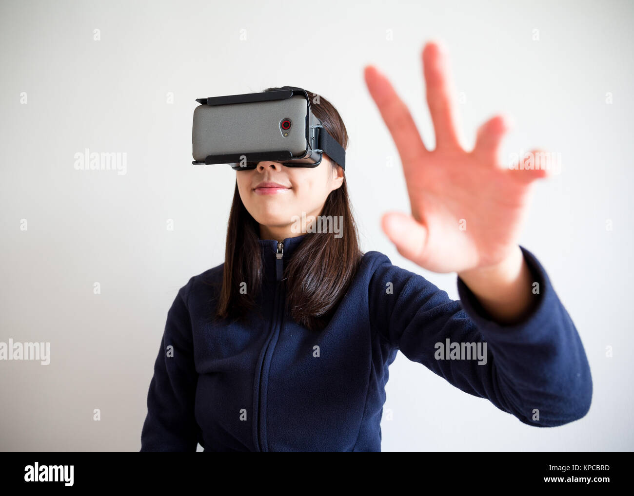 Woman hand raised up and touch something Stock Photo - Alamy