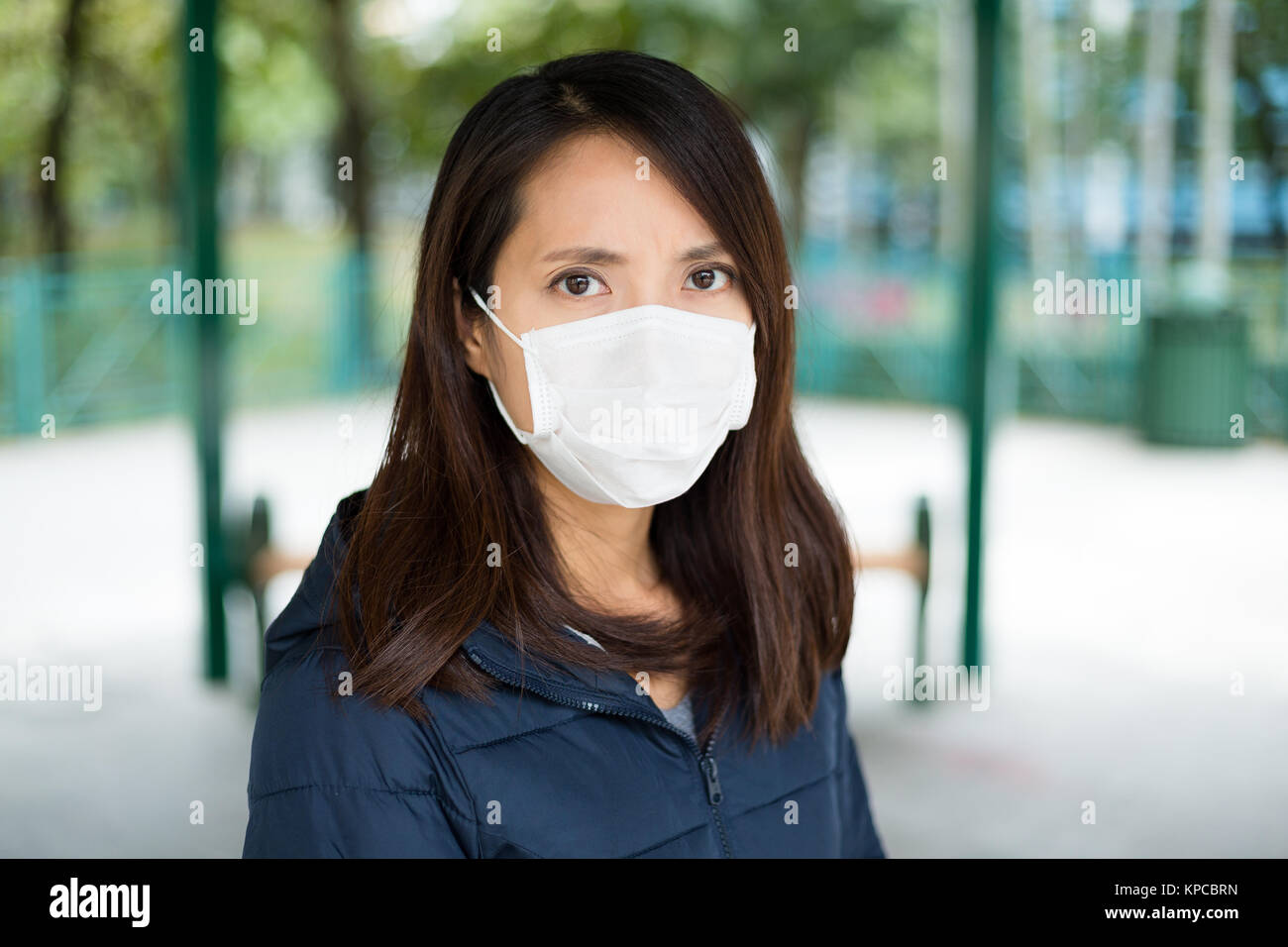 Asian woman wearing a face mask Stock Photo - Alamy