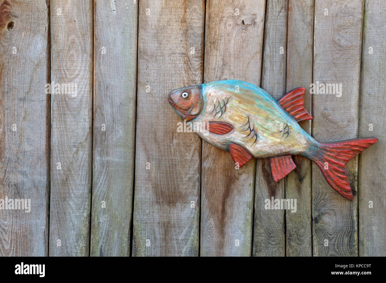 wooden fish on wooden boards,background Stock Photo - Alamy
