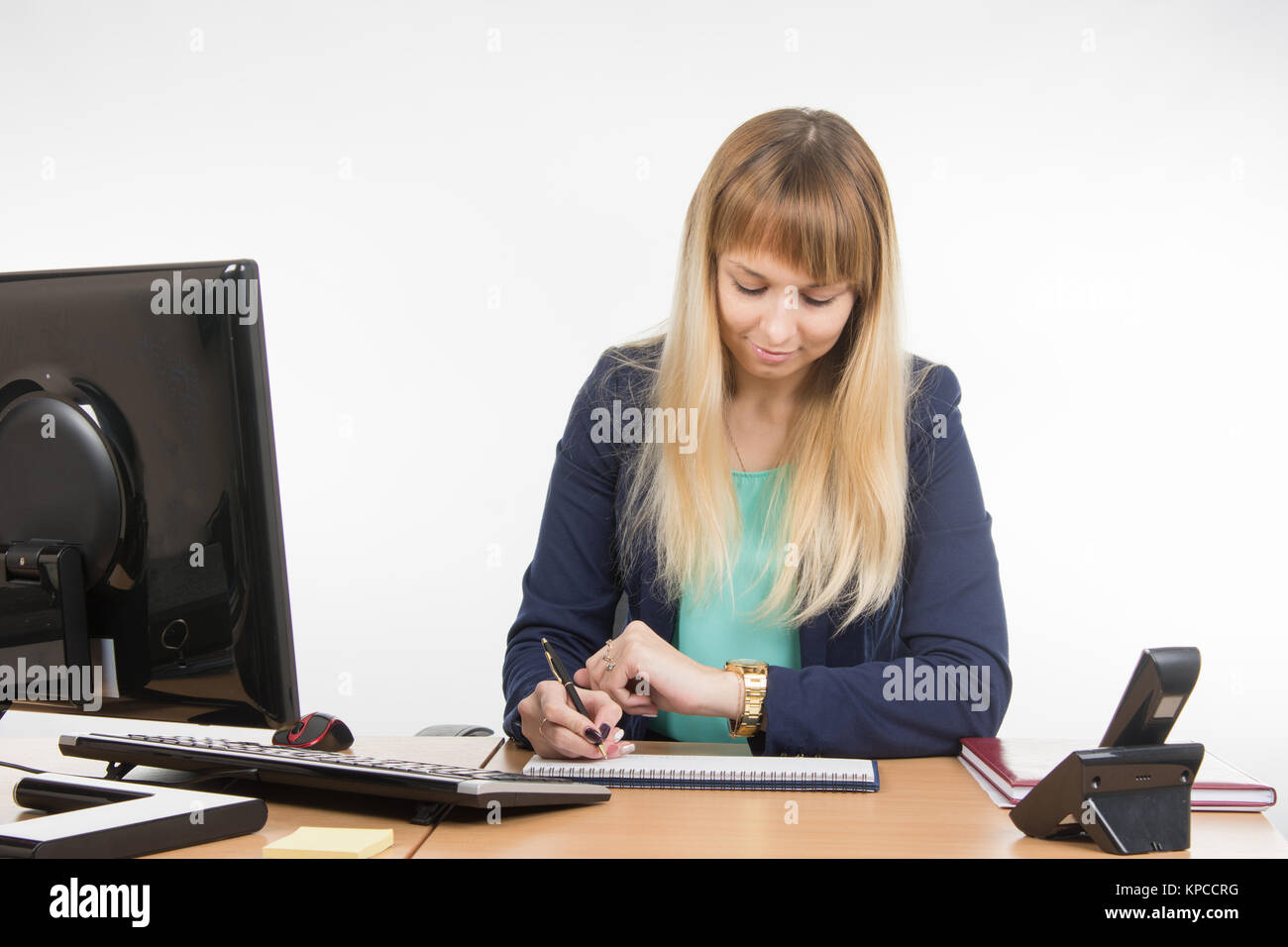 Business woman looking at his watch and schedule of the working day ...