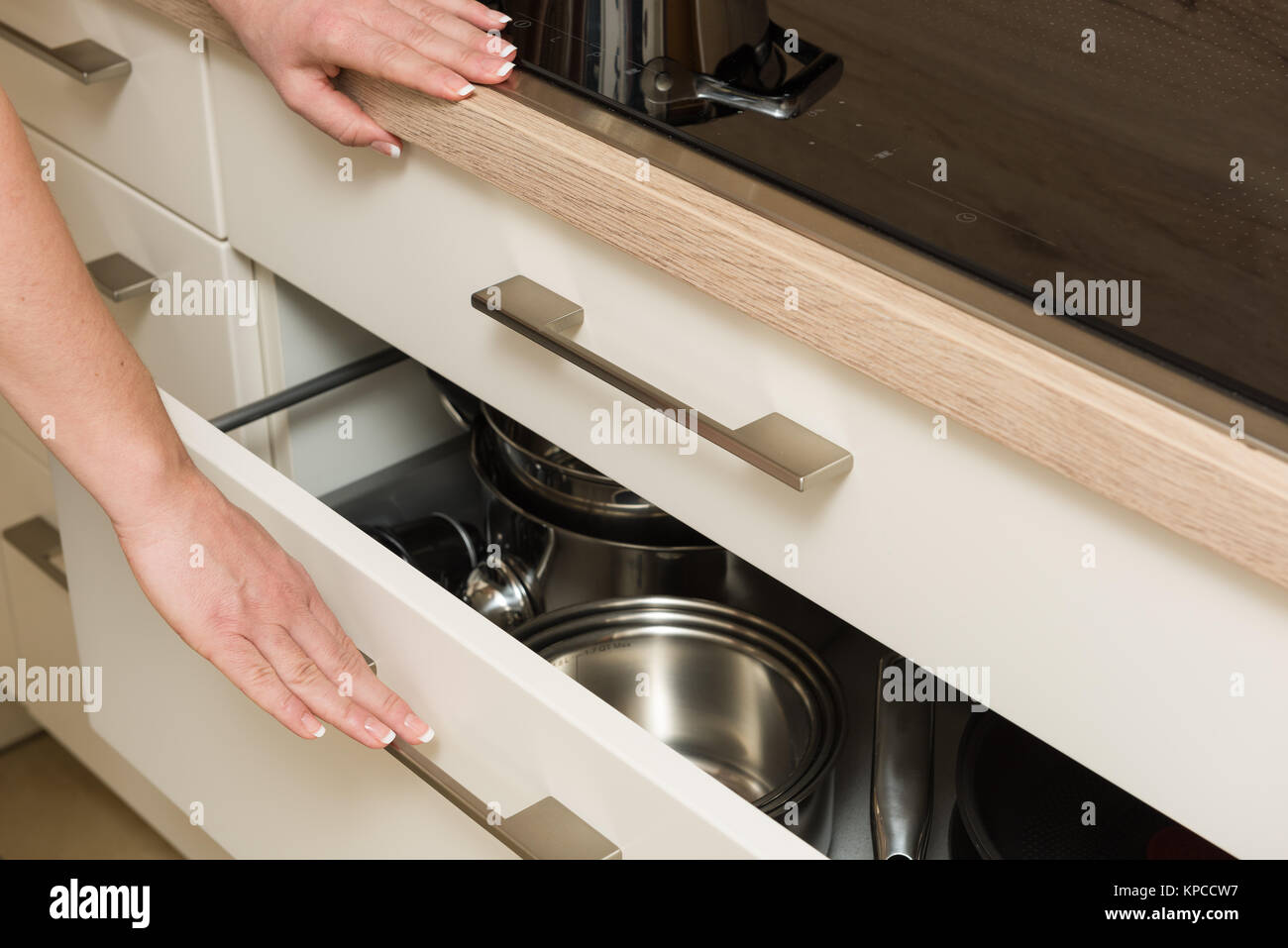 Workflow in a modern kitchen: view on touch panel cooker with open ...