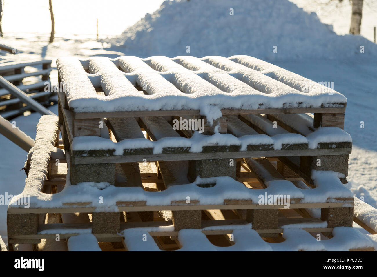 Box Pallets Covered in Snow Stock Photo - Alamy