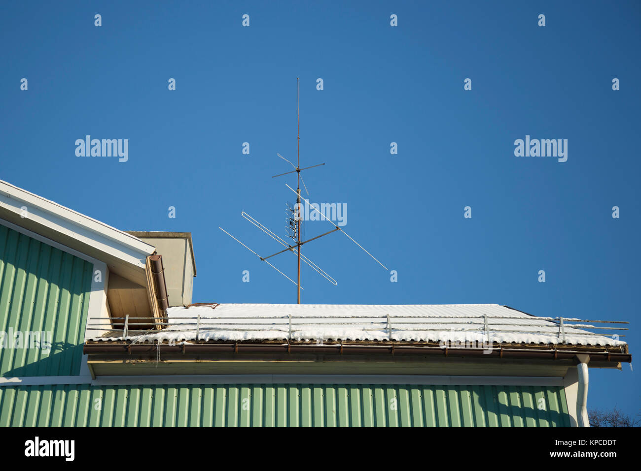 TV Antenna on Snow Covered Roof Stock Photo - Alamy