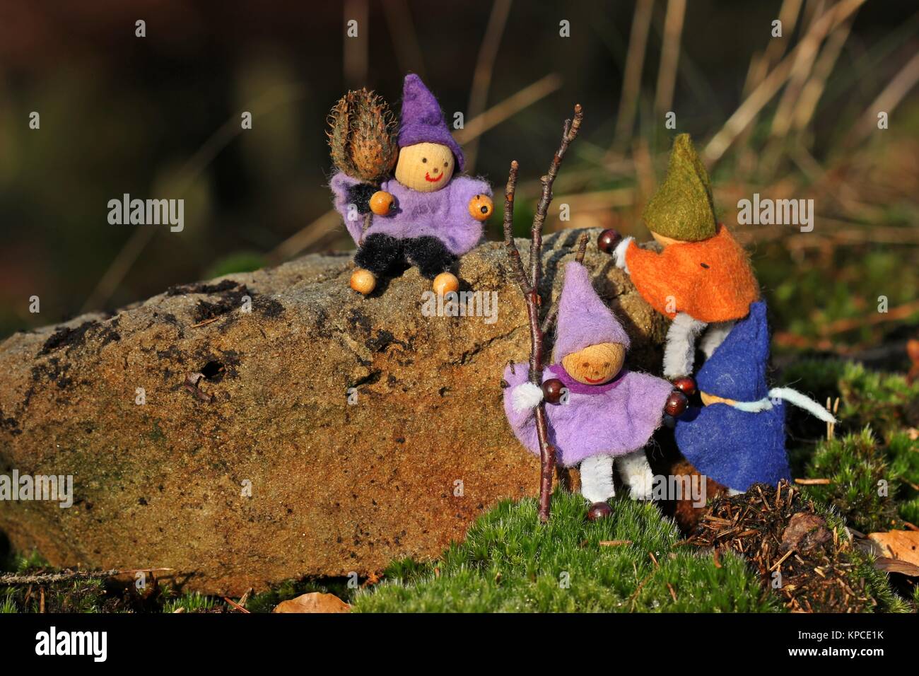 four goblin climb a stone Stock Photo - Alamy