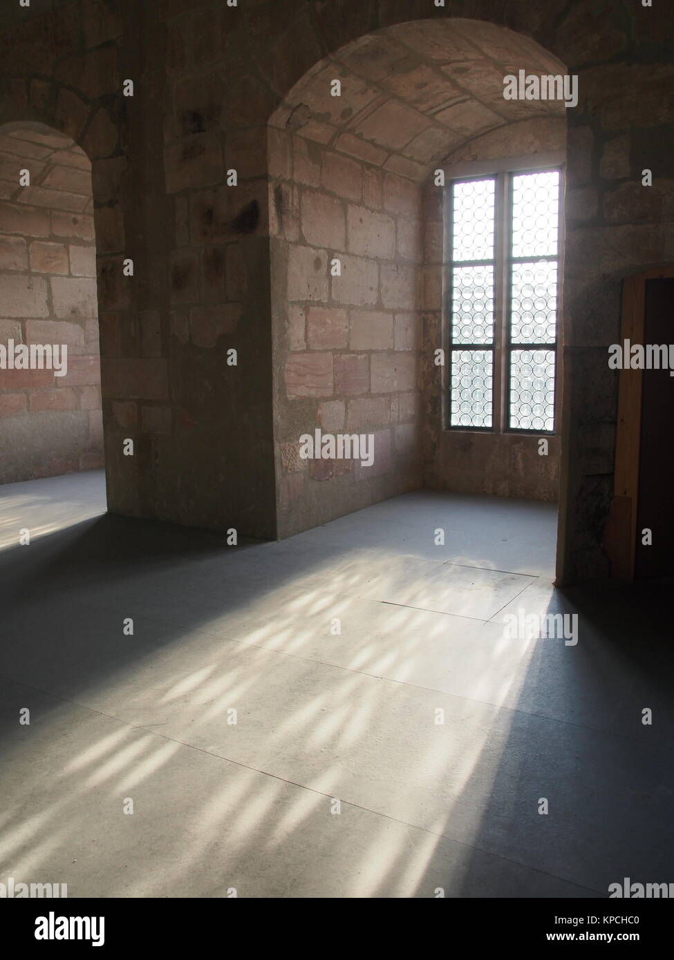 Light falling through a window in the castle of Cadolzburg Stock Photo ...