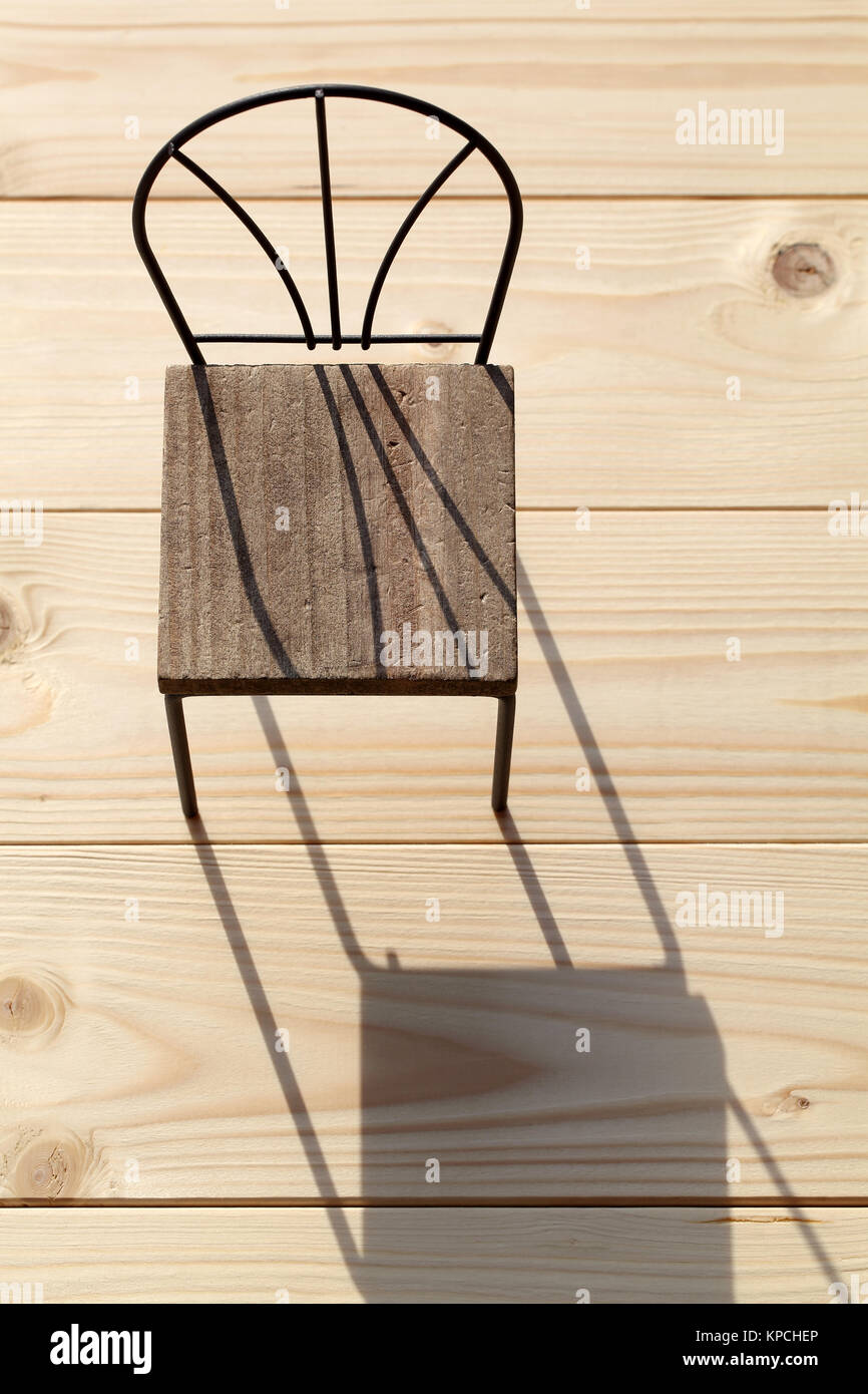 chair and shadow on the wooden floor Stock Photo - Alamy