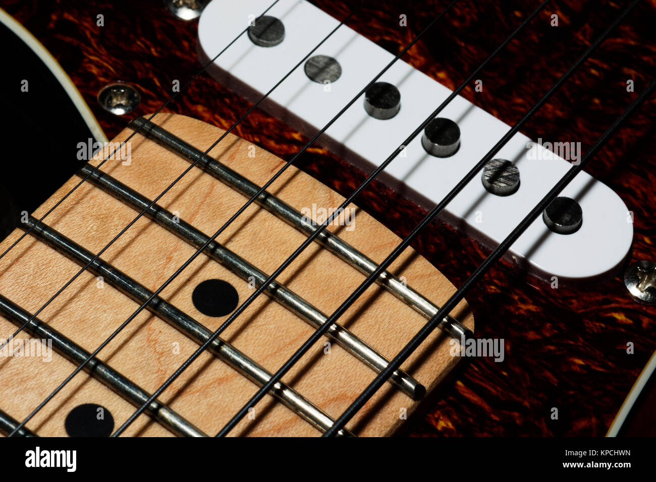 Electric guitar frets, strings & pickup Stock Photo - Alamy