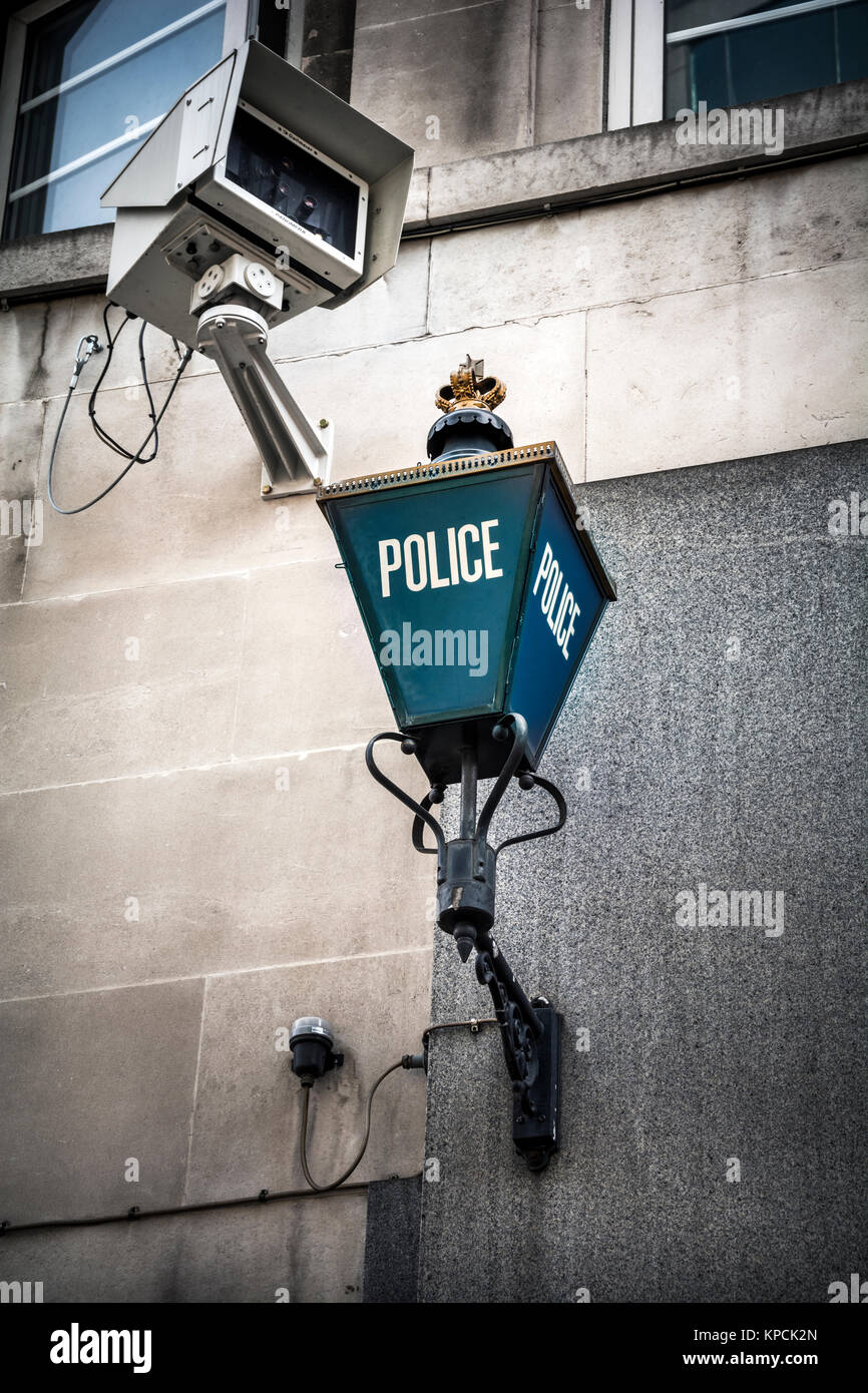 Police sign and surveillance camera Stock Photo - Alamy