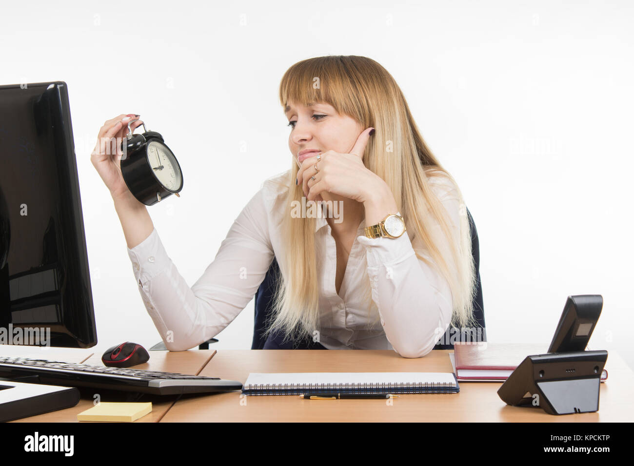Office employee sadly looks at the clock with time nine oclock five ...