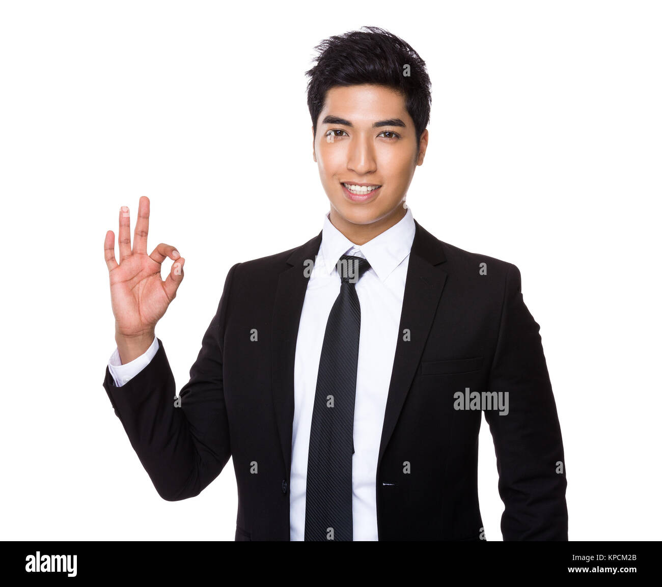 Businessman showing ok sign gesture Stock Photo - Alamy