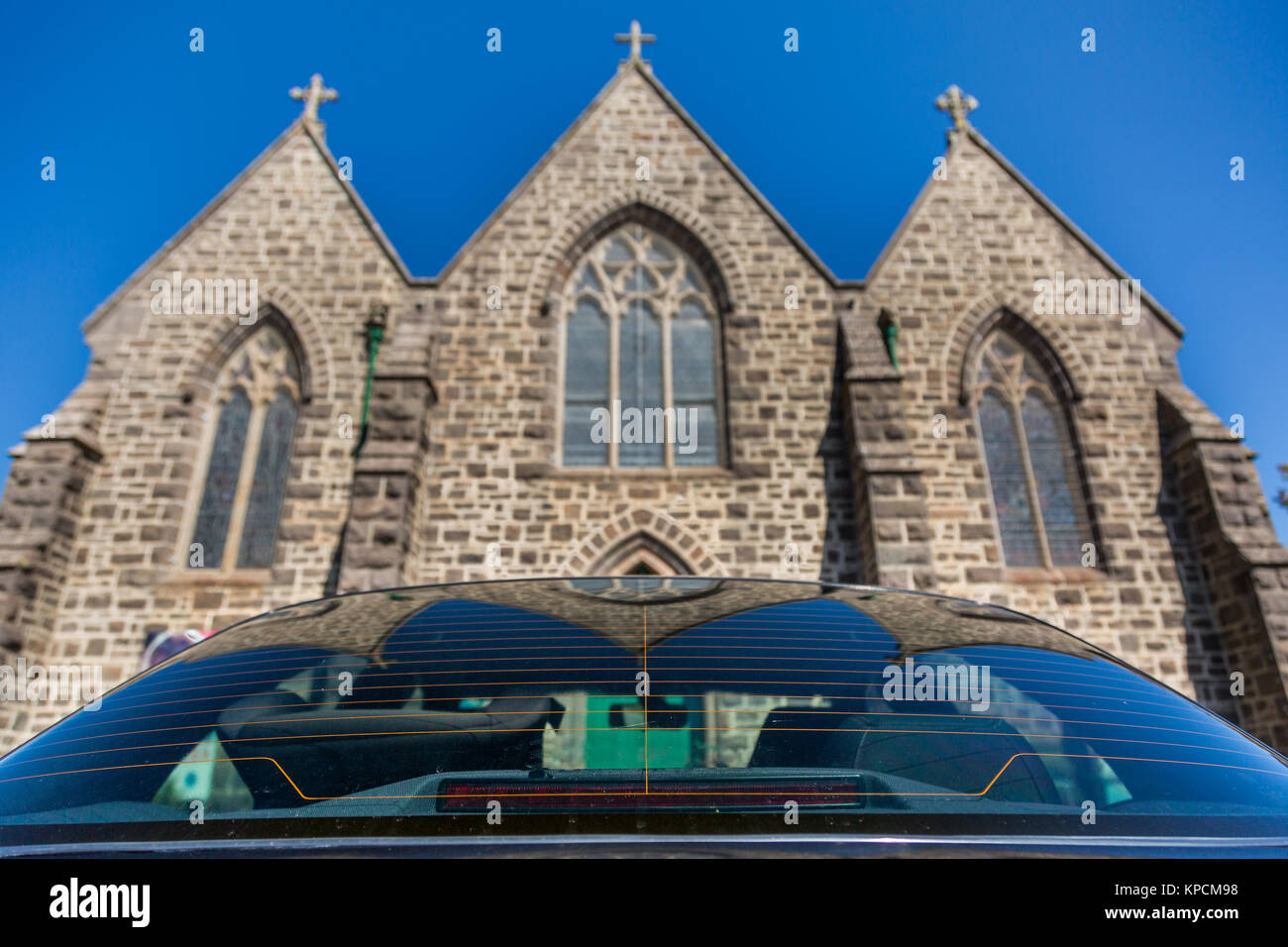Large Catholic Church viewed from behind a car Stock Photo - Alamy