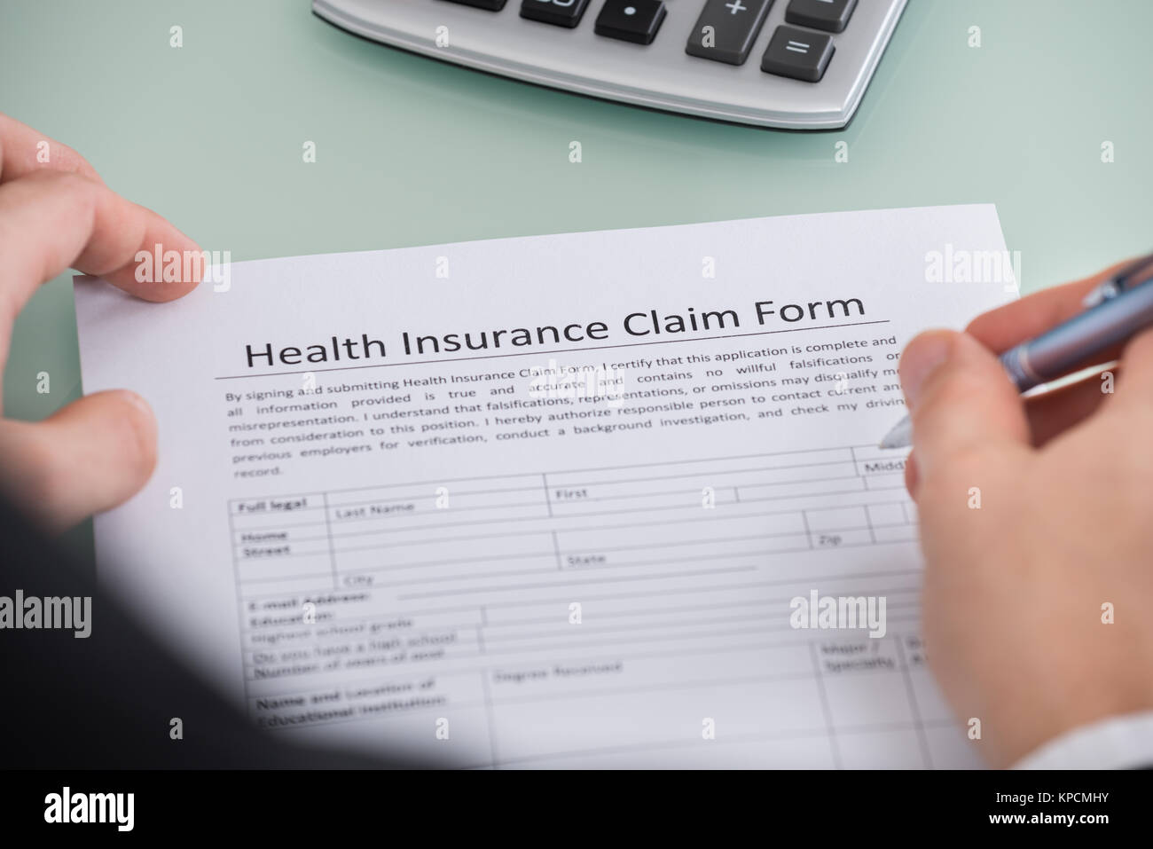 Person Filling Health Insurance Claim Form Stock Photo - Alamy