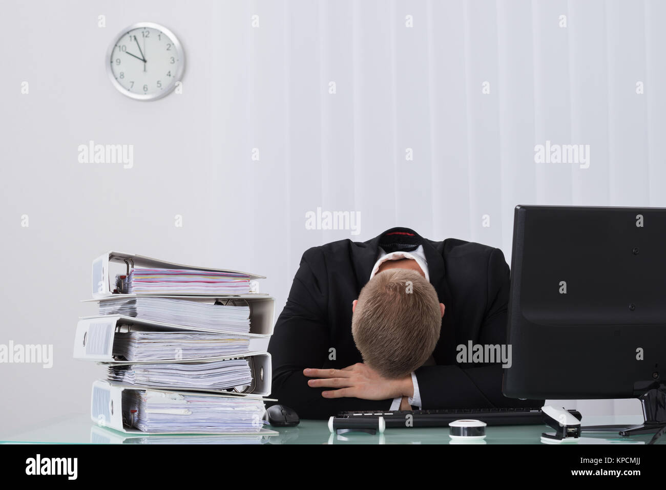 Male Businessman Sleeping In Office Stock Photo - Alamy