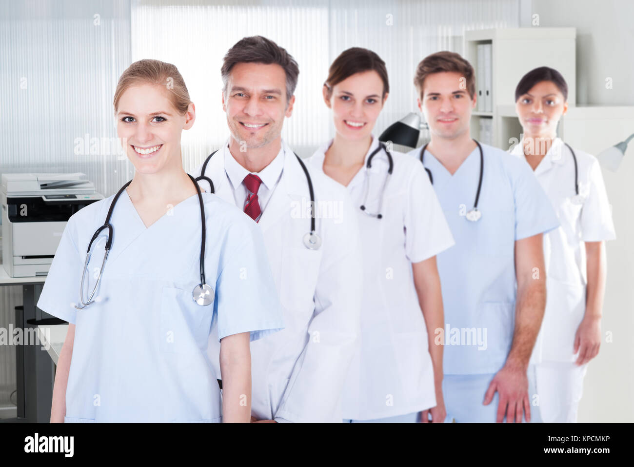 Doctors And Nurses Standing In A Row Stock Photo - Alamy