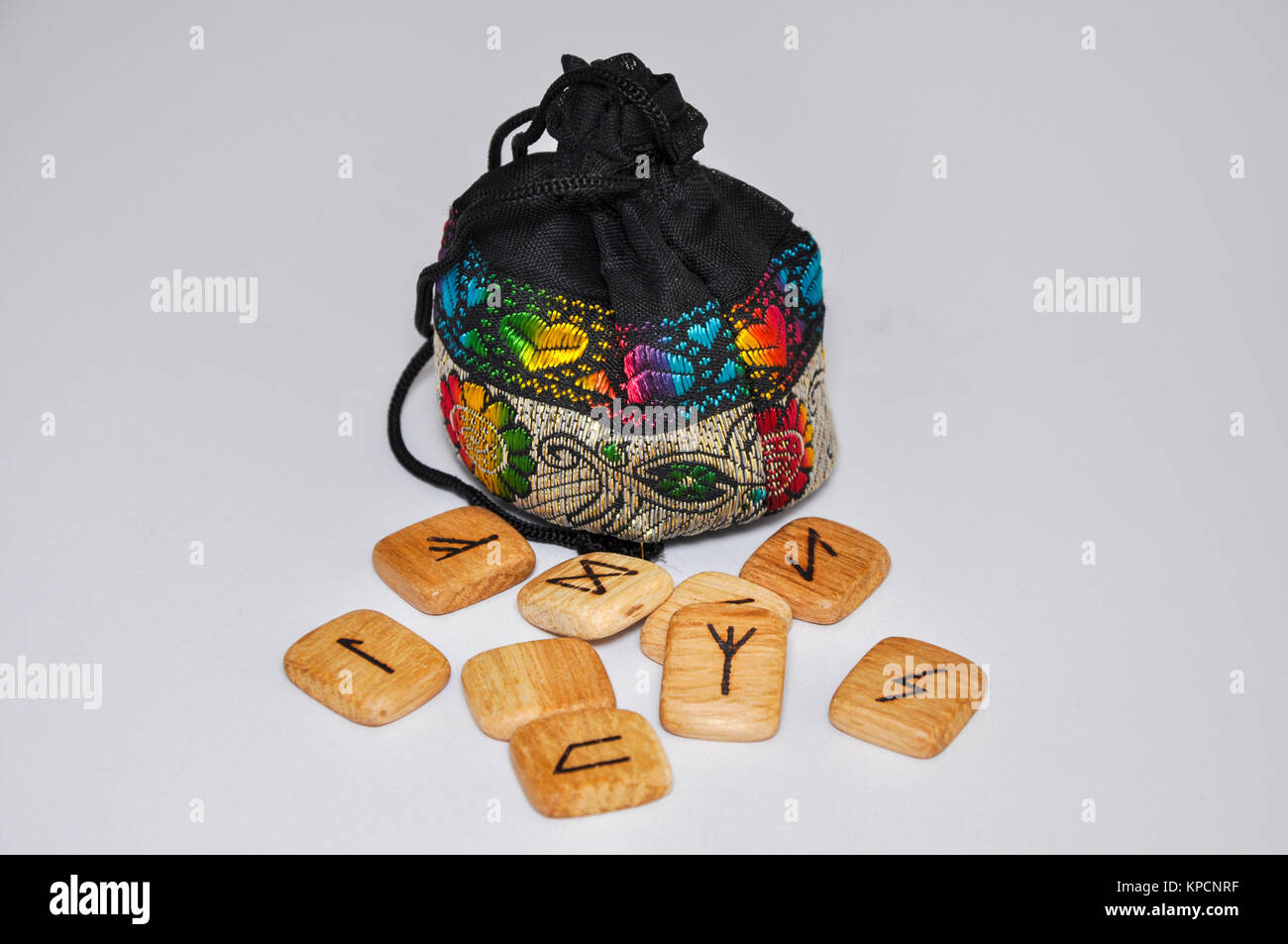 Wooden runes on a white background Stock Photo - Alamy