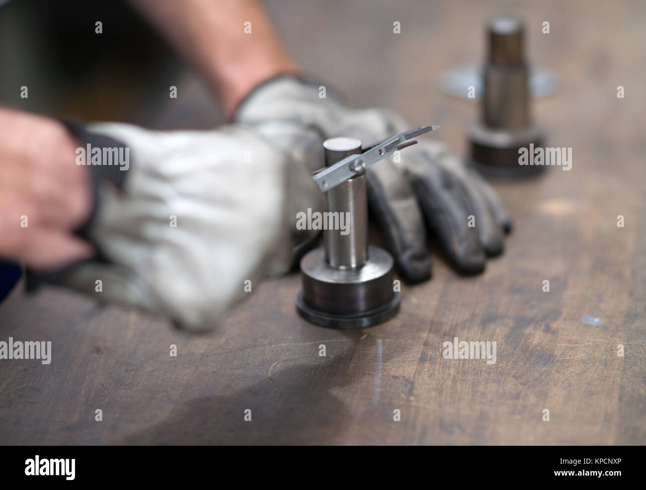 workers hand measuring a metal workpiece Stock Photo - Alamy
