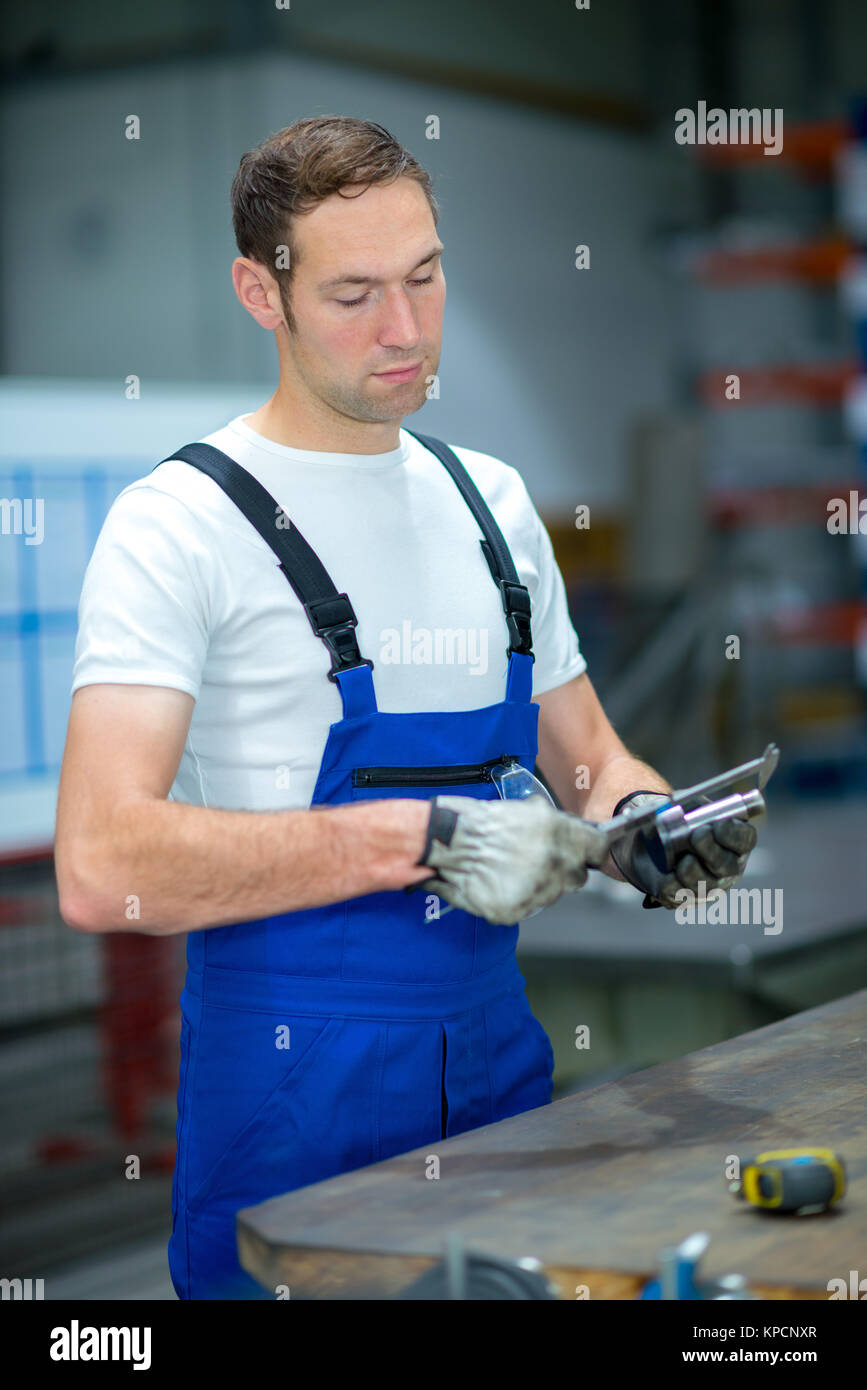 worker on work bench in the factory Stock Photo - Alamy