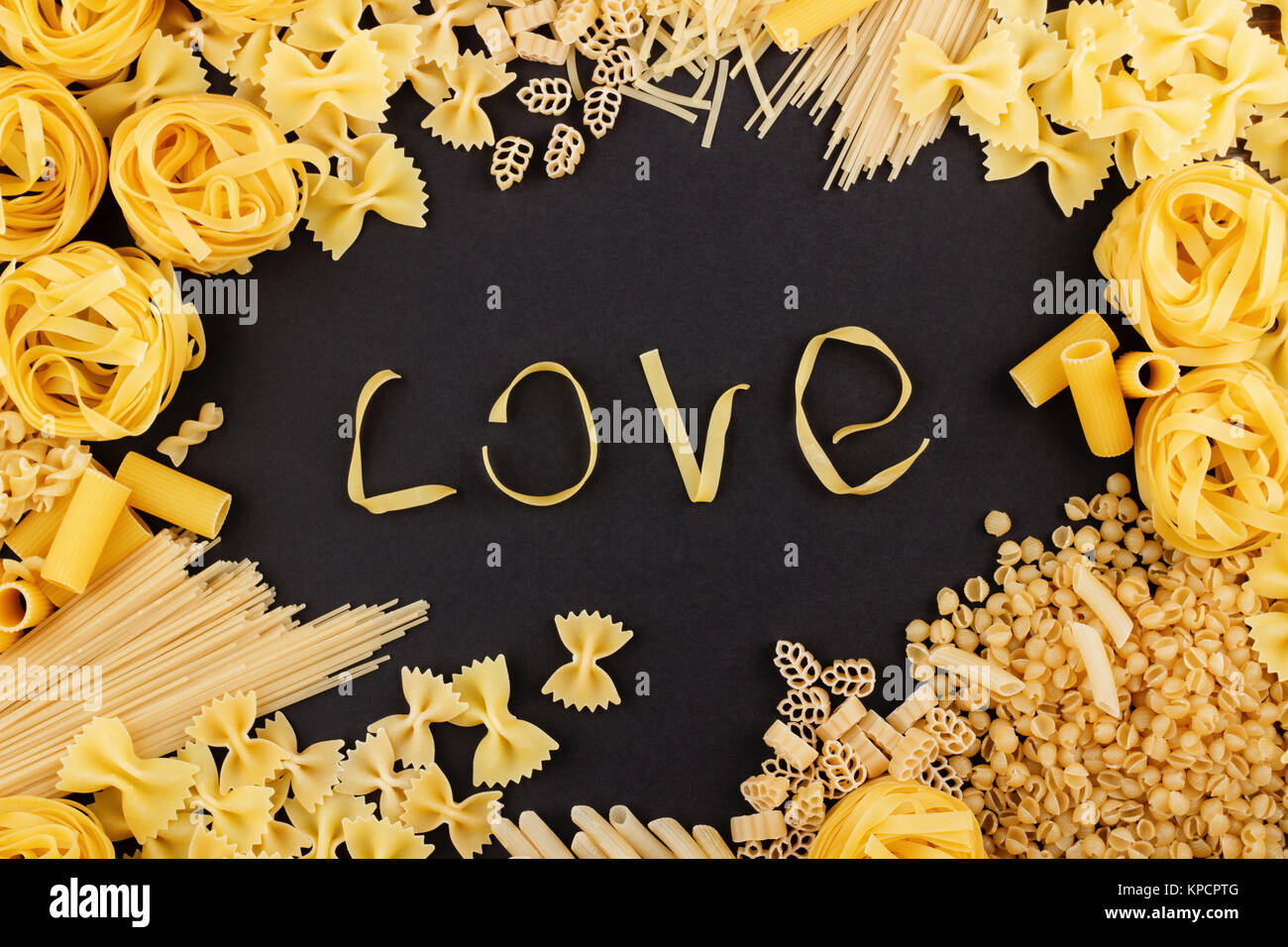 Word Love from pasta on the black background Stock Photo - Alamy