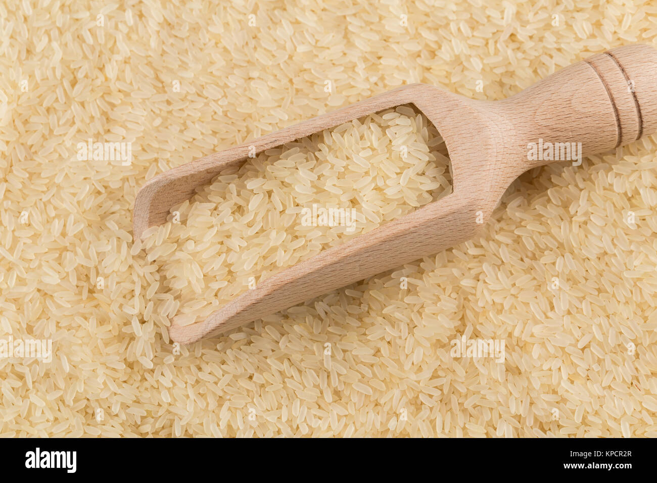 Rice in spoon Stock Photo - Alamy