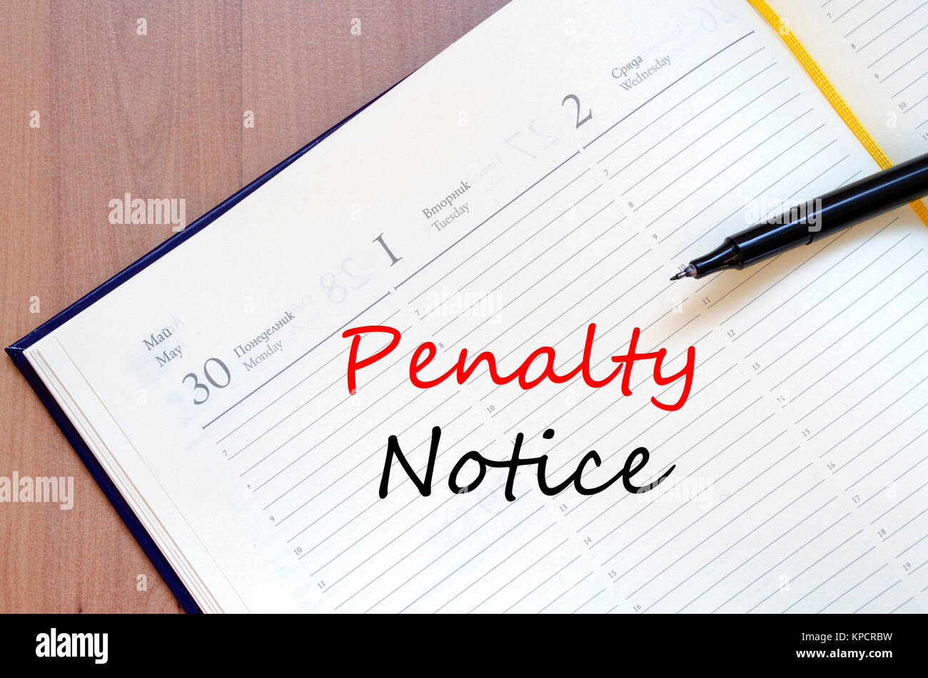 Penalty notice write on notebook Stock Photo - Alamy