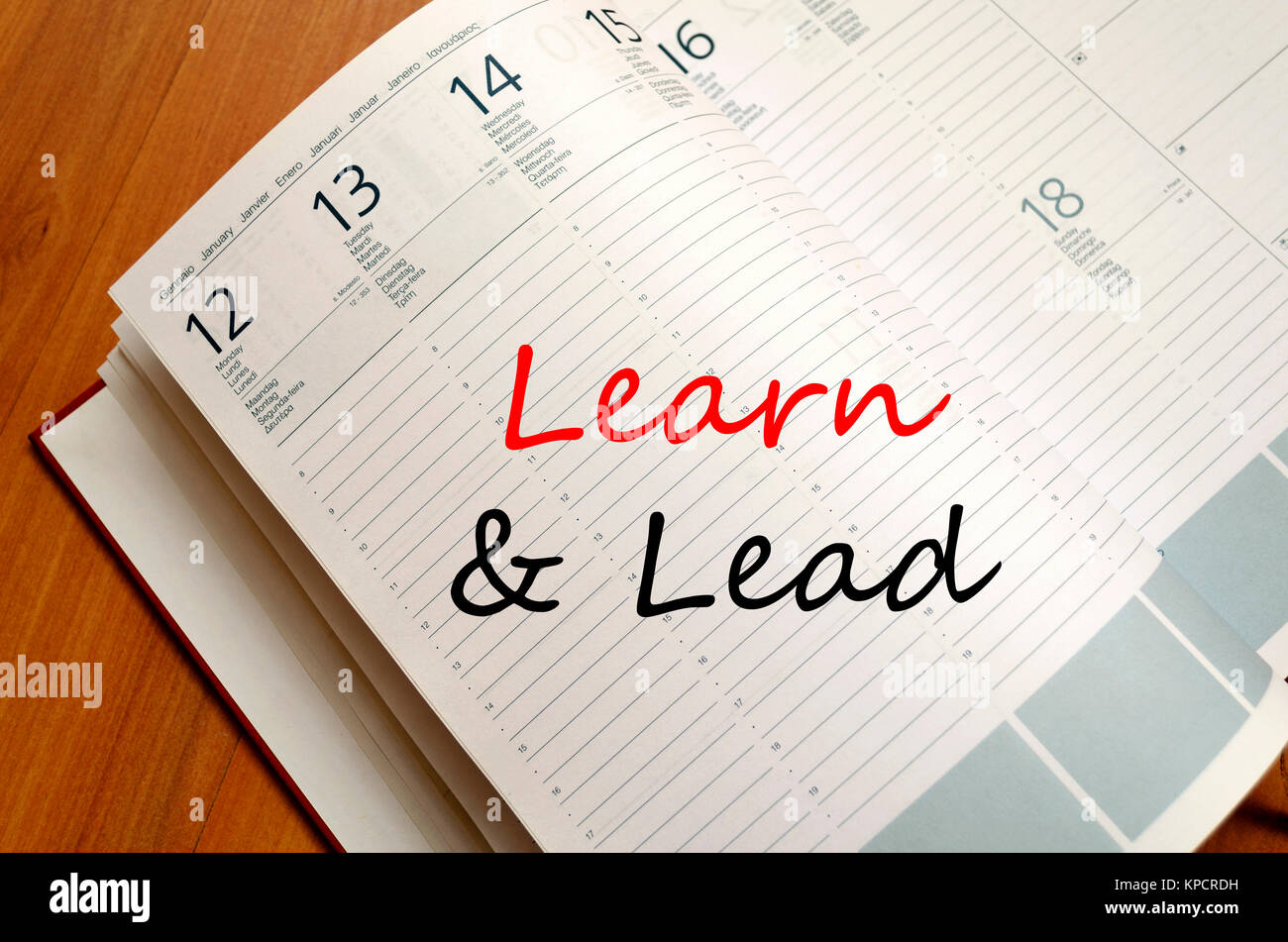 Learn & Lead write on notebook Stock Photo - Alamy