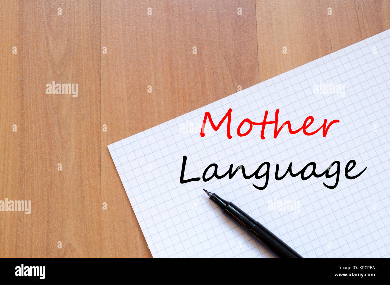 Mother language write on notebook Stock Photo - Alamy