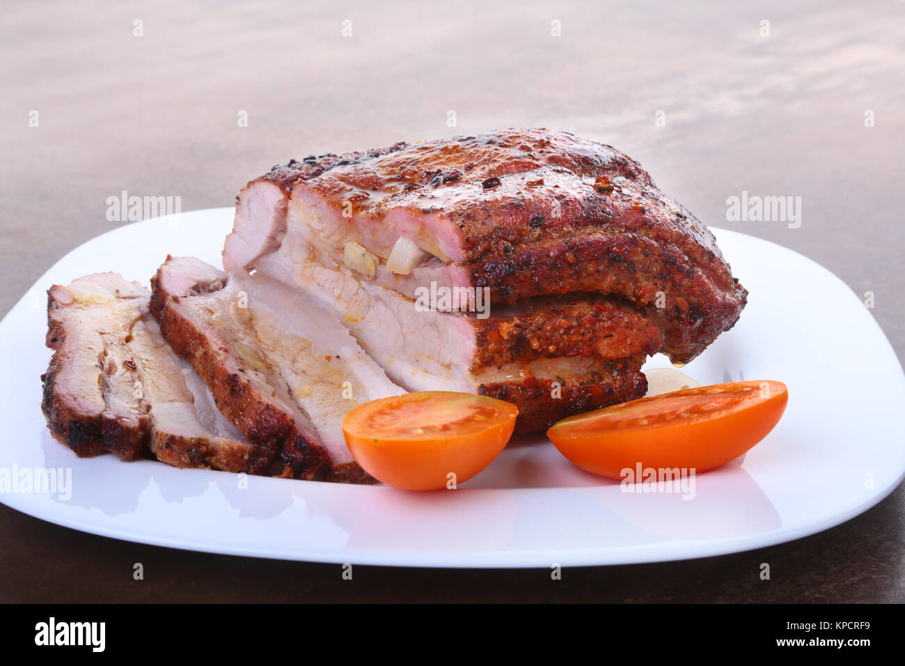 grilled pork chops with tomato and ketchup on plate Stock Photo - Alamy