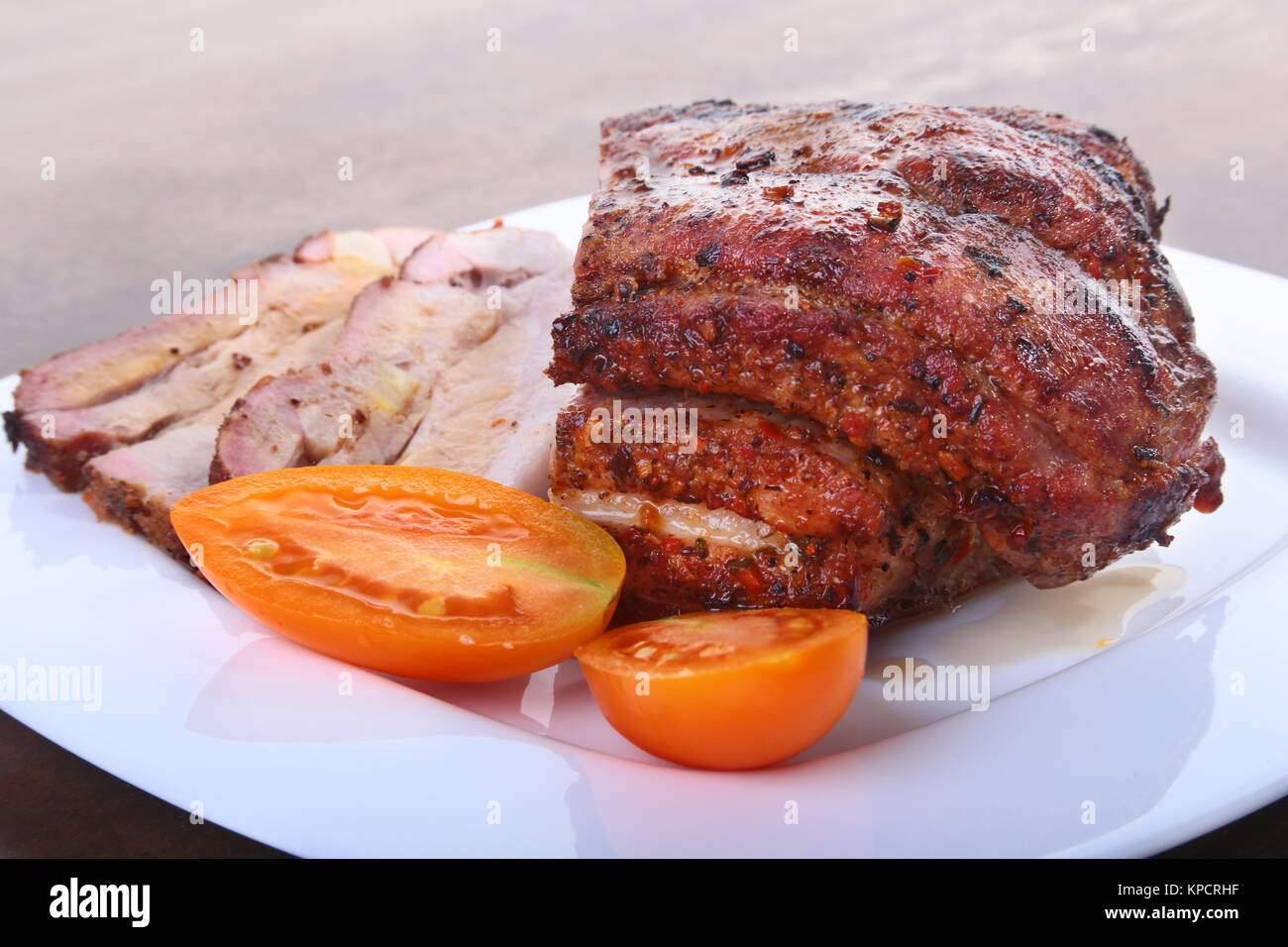grilled pork chops with tomato and ketchup on plate Stock Photo - Alamy