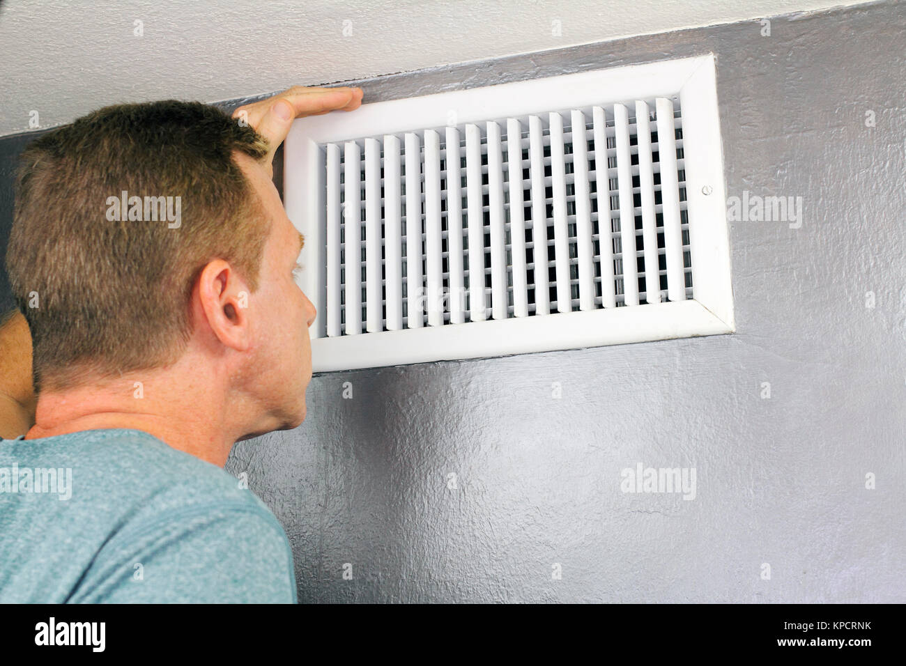 Inspecting a Home Air Vent for Maintenance Stock Photo - Alamy